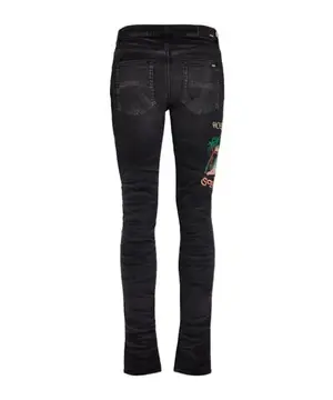 Amiri Skinny Jeans With Embroidery And Distressing