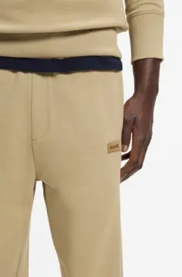 Hugo Cotton-terry Sweatpants With Logo Badge - Beige