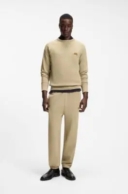 Hugo Cotton-terry Sweatpants With Logo Badge - Beige
