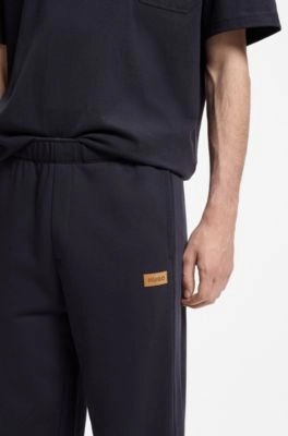 Hugo Cotton-terry Sweatpants With Logo Badge - Dark Blue