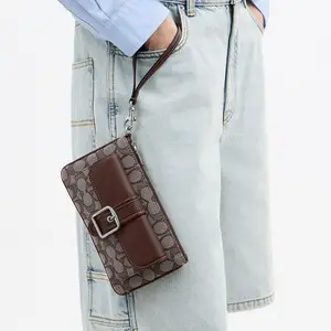 COACH OUTLET Coach Signature Jacquard Wristlet With Leather Accents - Silver/oak/maple