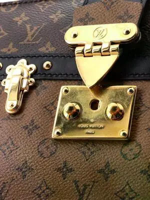 LOUIS VUITTON Reverse Monogram Canvas Clutch Bag