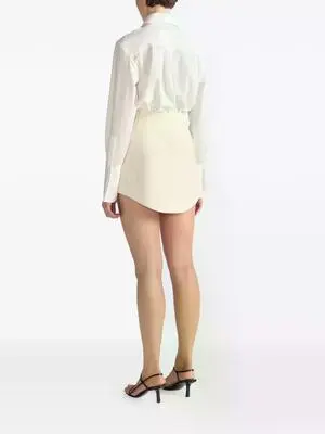 THE ARKOW Rose Curved Hem Mini Skirt