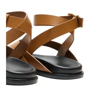 STUART WEITZMAN Round Toe Flat Sandals With Clasp