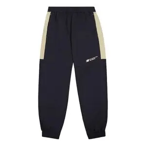 NEW BALANCE Woven Track Pants Asia Sizing - Black