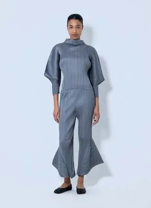 Issey Miyake Mid Rise Flared Pleated Trousers
