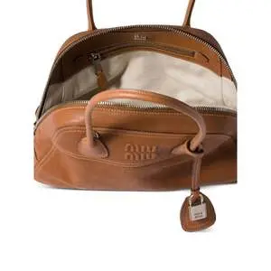 Miu Miu Suede Top Handle Bag With Embossed Logo And Padlock Detail