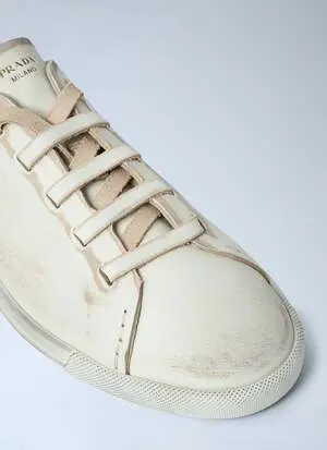 Prada Distressed Leather Lace-up Sneakers - White