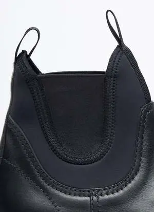 Prada Blixxen Leather Chelsea Boots - Black
