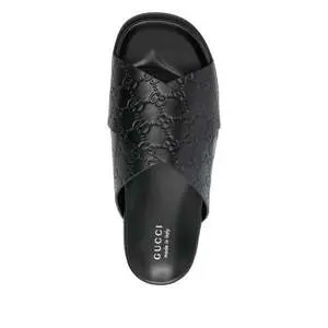Gucci Interlocking G Embossed Leather Criss-cross Strap Flat Sandals