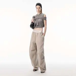 Alexander Wang Mid-rise Pleated Wide-leg Pants With Logo Elastic Waist - Stone