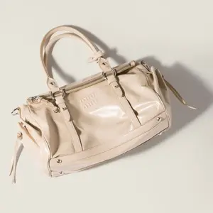 Miu Miu Shiny Leather Handbag With Drawstring Pockets - Traverite