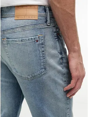 Tommy Hilfiger Straight Leg Jeans With Distressed Detailing - Medium Wash Denim