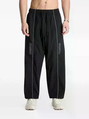 PLEASURES Sound Logo-print Reflective Track Pants