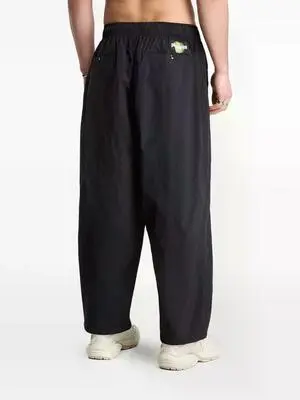 PLEASURES Sound Logo-print Reflective Track Pants
