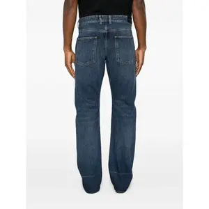 Givenchy Faded-wash Raw-cut Jeans