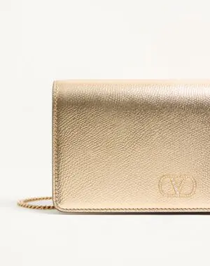 Valentino Garavani Vlogo Signature Mini Shoulder Bag In Laminated Grainy Calfskin With Jewel Logo - Gold/crystal