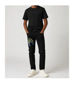 Amiri Staggered Logo-print Jeans