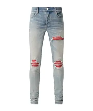 Amiri Jeans With Distressed Detail