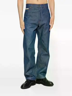 Moschino Tapered-leg Jeans With Logo Patch
