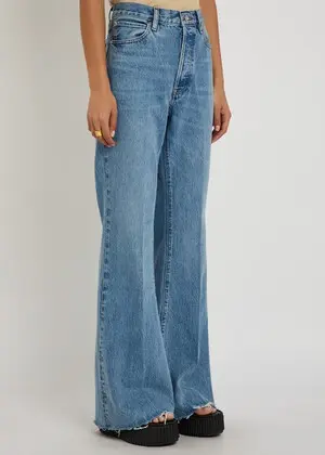 FRAME The Lax Distressed Flared-leg Jeans - Blue