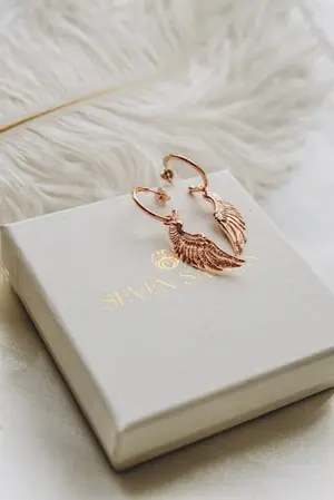 SEVEN SAINTS Angel Wing Small Hoop Earrings - Rose