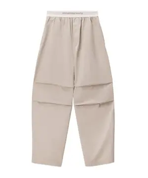 Alexander Wang Logo-elastic Pleated-knee Trousers - Stone