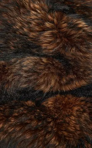 Saint Laurent Long Shearling Muffs With Silk Lining