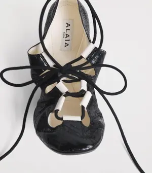 Alaïa Snakeskin Lace-up Ballet Flats - Clear