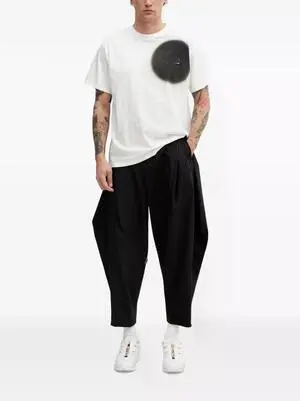ADER ERROR Pleated Tapered-leg Trousers