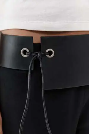 ST. AGNI Asymmetric Leather Belt With Silver Eyelets And Tie Detail