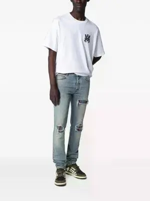 Amiri Distressed-effect Patched Jeans