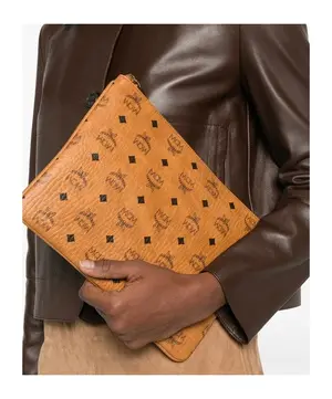 Mcm Logo Patterned Zipped Clutch Bag