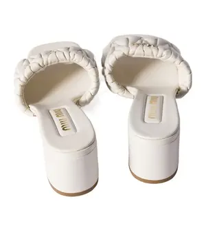 Miu Miu Matelassé Nappa Leather Slides With Gold Lettering Logo - White