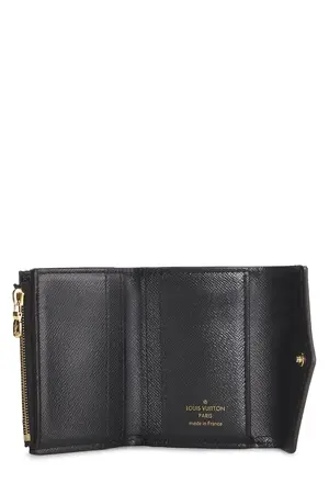 LOUIS VUITTON Monogram Reverse Giant Canvas Zoe Wallet