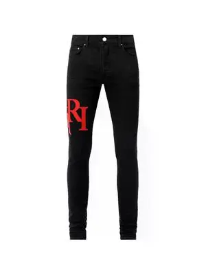 Amiri Skinny Jeans With Staggered Logo Detail - Black