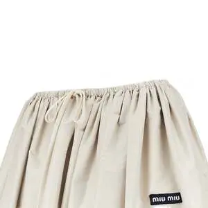 Miu Miu Mini Skirt With Logo Patch - Beige