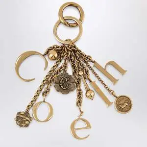 Chloé Bag Charm With Logo And Symbols In Vintage Gold Brass - Silver