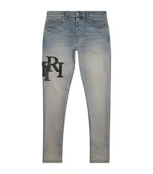 Amiri Staggered Logo Skinny Jeans - Blue