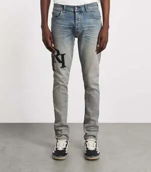 Amiri Staggered Logo Skinny Jeans