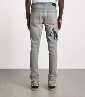 Amiri Staggered Logo Skinny Jeans