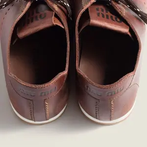 Miu Miu Plume Leather Sneakers