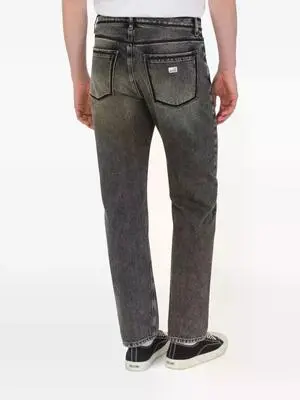 Moschino Faded-effect Logo-patch Jeans