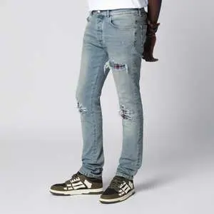 Amiri Mx1 Distressed Flannel-patched Jeans In Medium Indigo