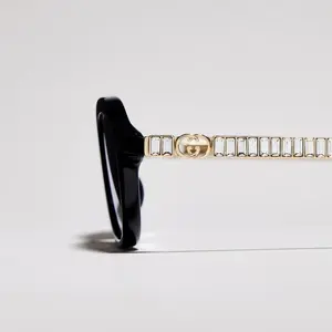 Gucci Oval Frame Sunglasses With Crystal Embellishments