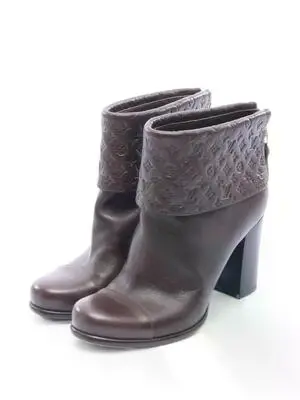 LOUIS VUITTON Monogram-embossed Ankle Boots
