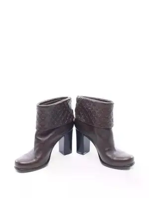LOUIS VUITTON Monogram-embossed Ankle Boots