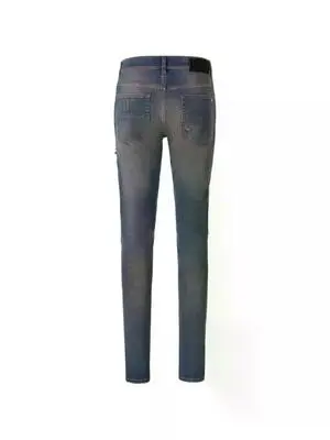 Amiri Distressed Ribbed-panel Jeans