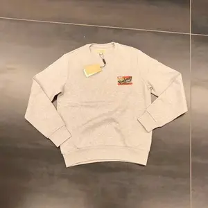 Burberry Long-sleeved Crew Neck Sweater With Printed Logo Detail
