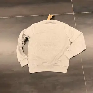 Burberry Long-sleeved Crew Neck Sweater With Printed Logo Detail